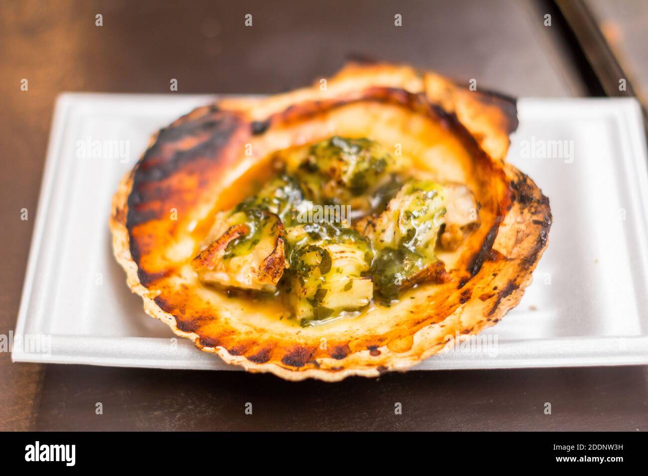 Grilled and torched scallops at the Kuromon Ichiban market in Osaka ...