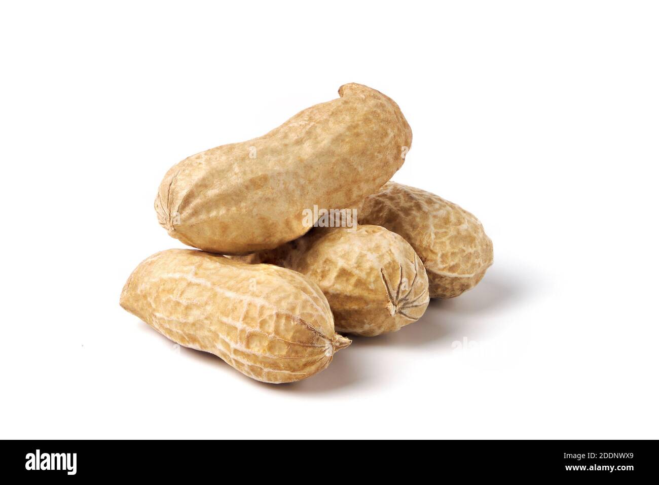 Raw peanuts isolated on white. Heap of groundnuts in a nutshell Stock ...