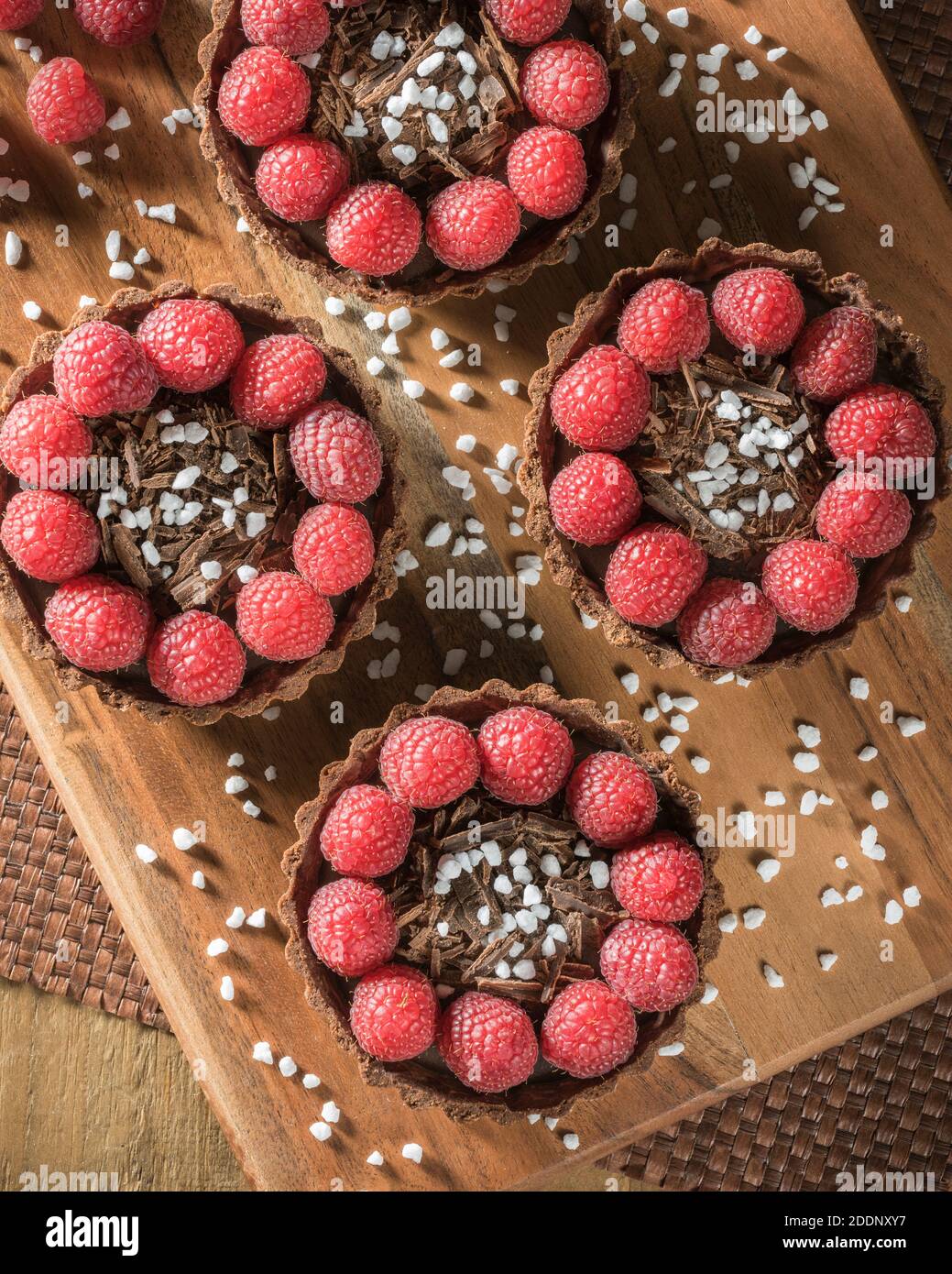 Chocolate and raspberry tarts Stock Photo - Alamy