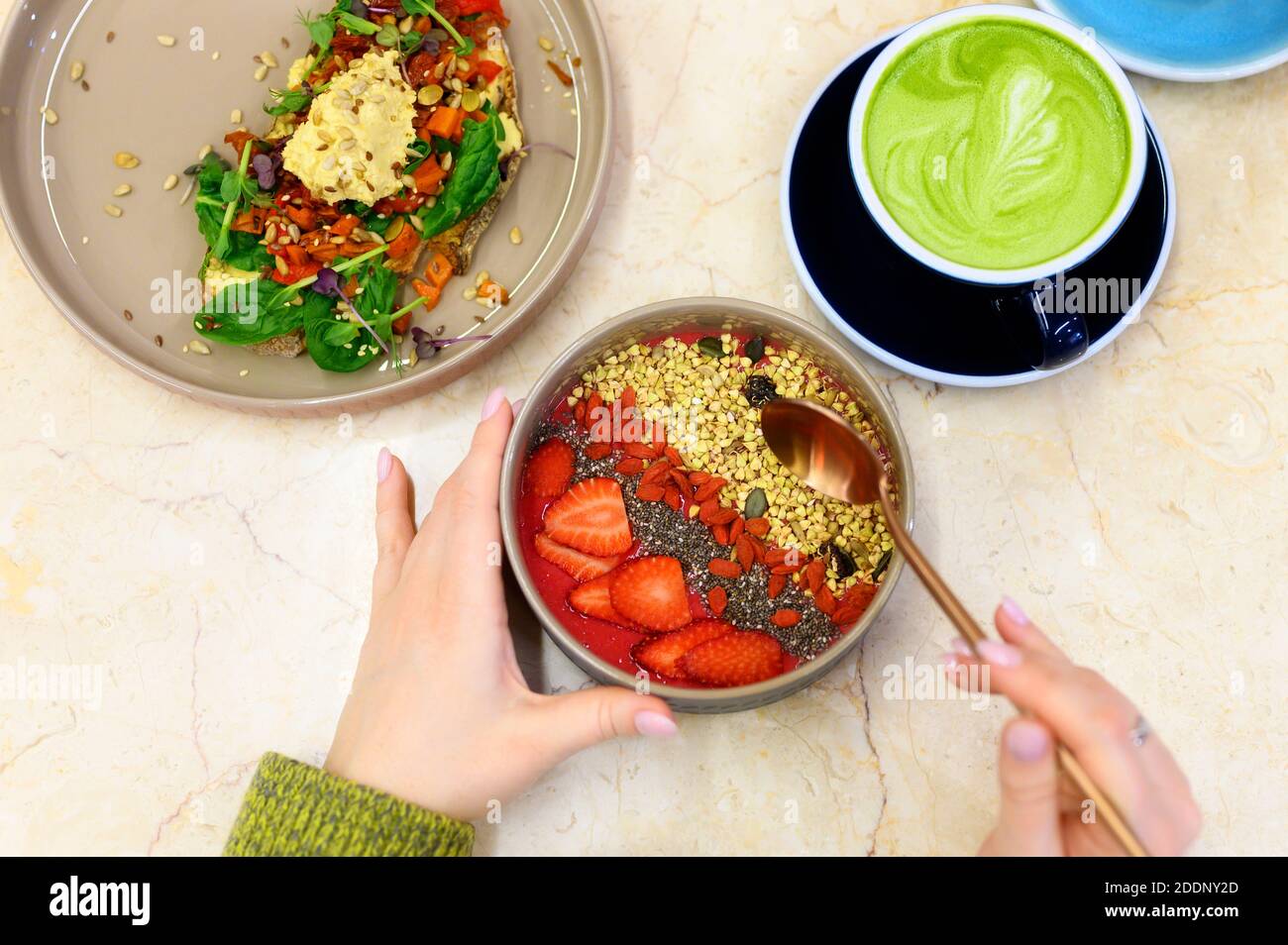 smoothie bowl with strawberry, goji, and green buckwheat granola, and ...