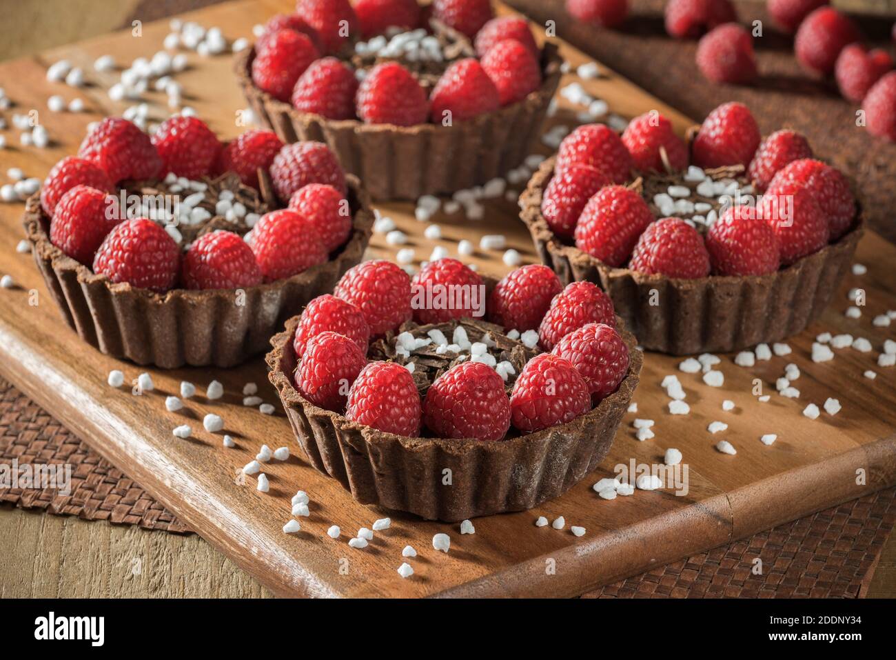 Chocolate and raspberry tarts Stock Photo - Alamy