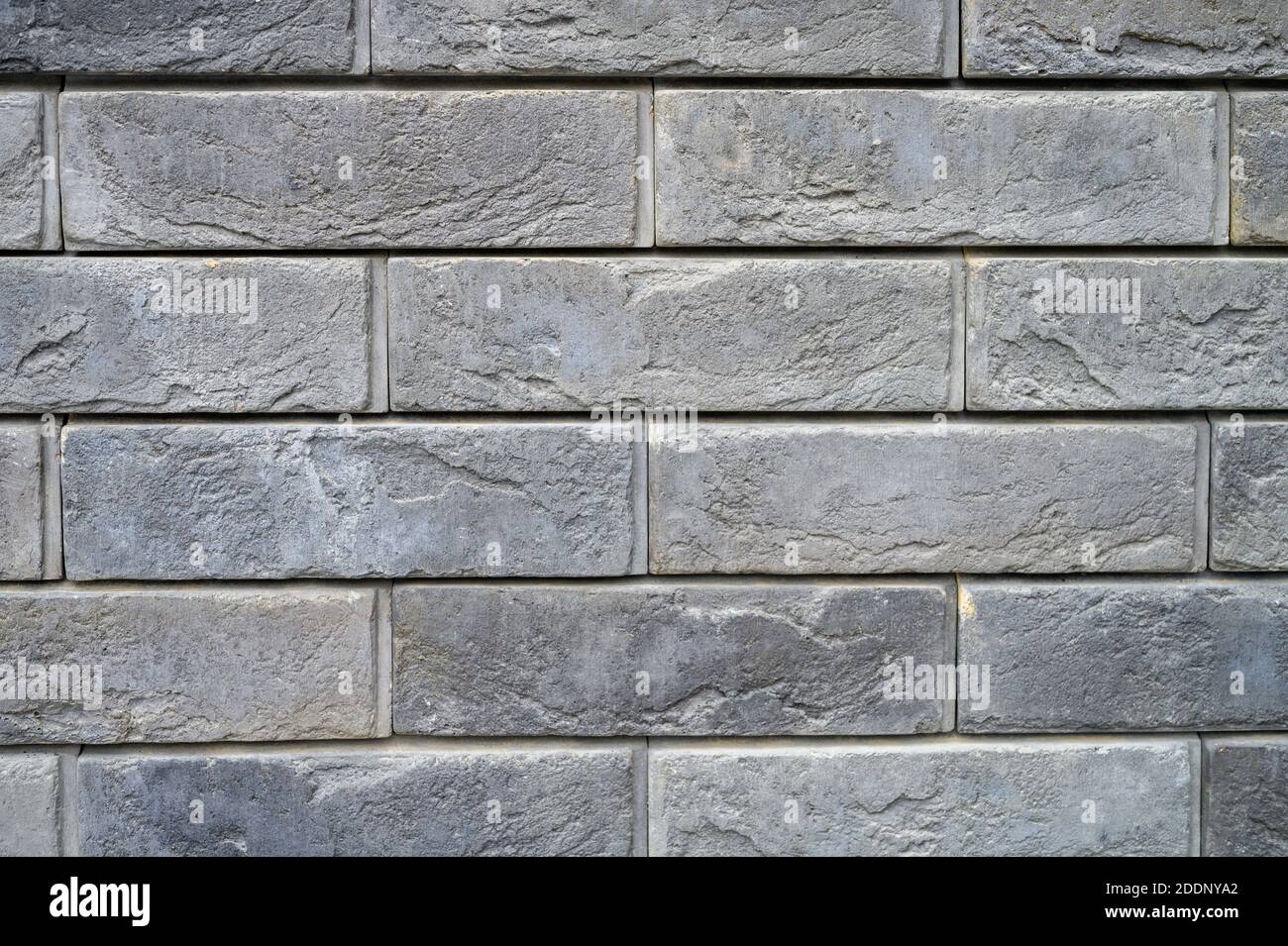 pattern of decorative gray slate stone wall surface as a background ...