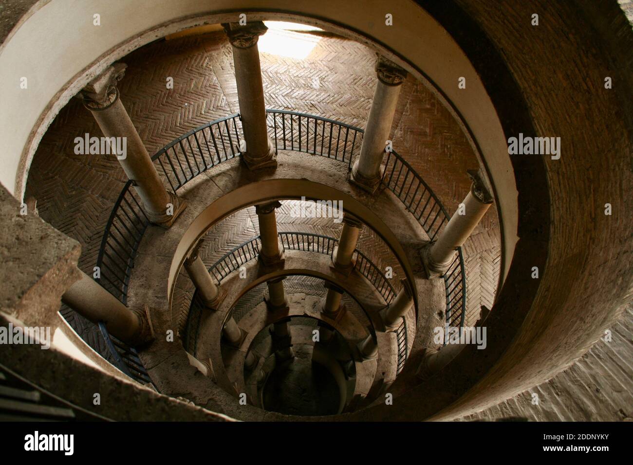 Spiral rounded ramp stairs. Into the dark, into the light. Rising up ...