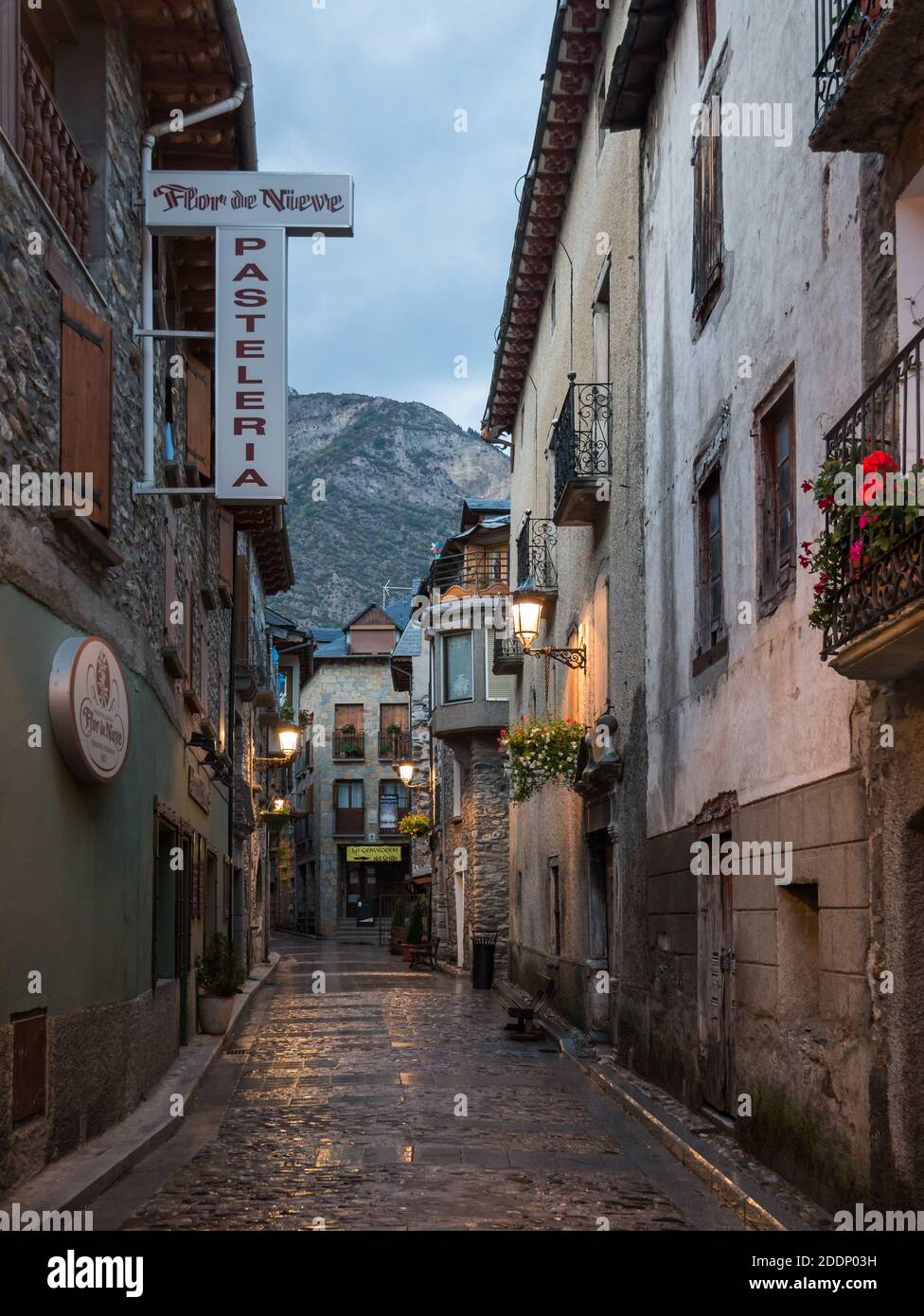 Streets of Benasque village at dusk on a rainy day in September. Huesca ...