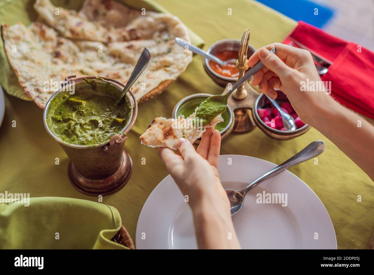 Caucasian Woman Eating Indian Food in Cafe. Traditional Indian dish ...