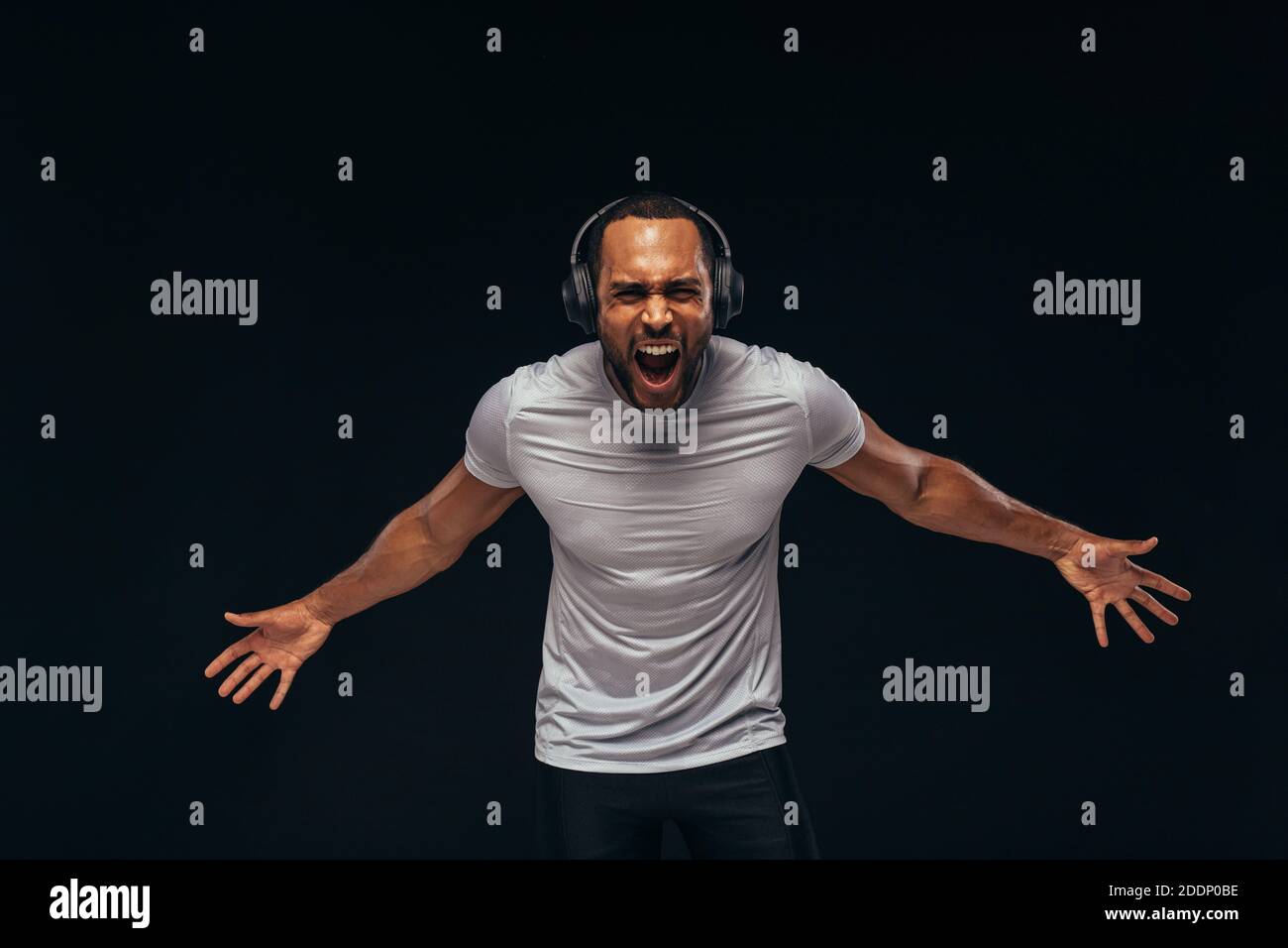 African american athlete shouting during workout. Fit man expressing ...