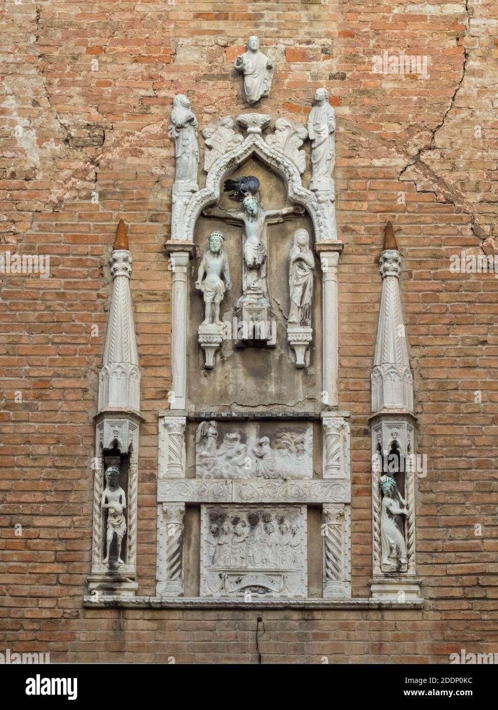 Bits of gothic architecture decoration on the brick facade of the ...