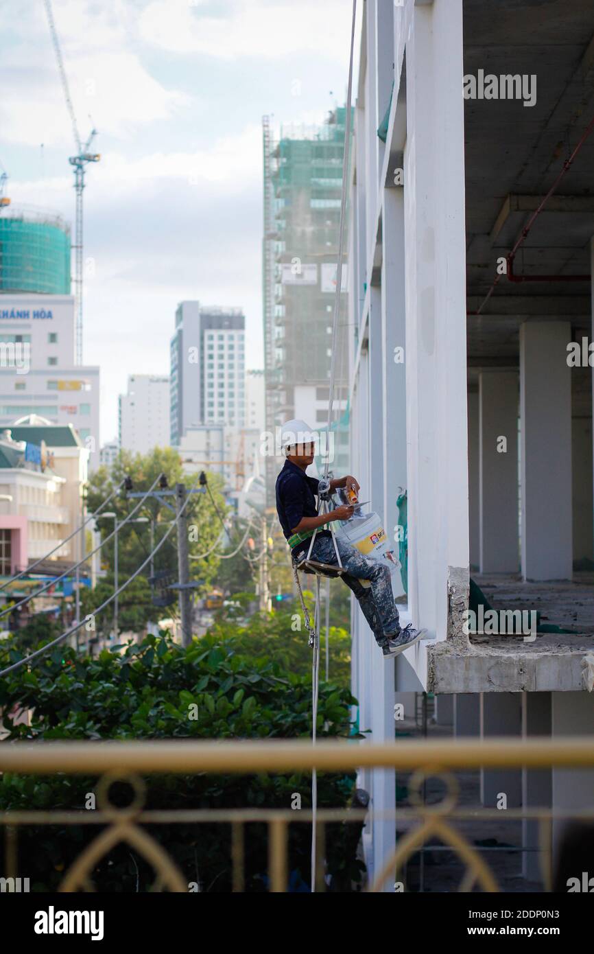 A painters risky job Stock Photo - Alamy