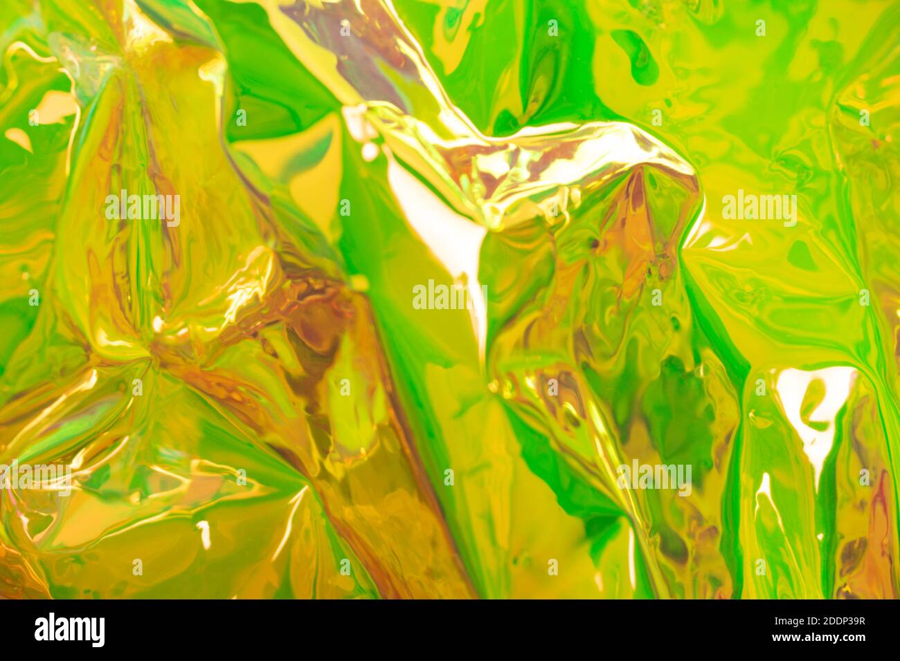 Yellow blurred holographic background. Wrinkled foil texture. Abstract ...