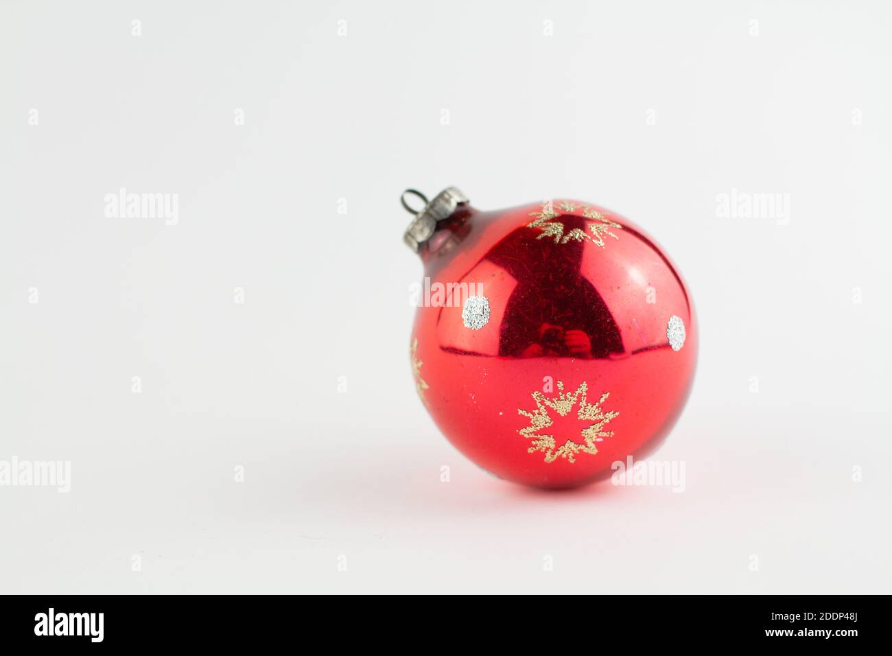 toy red ball for the christmas tree on a white Stock Photo - Alamy