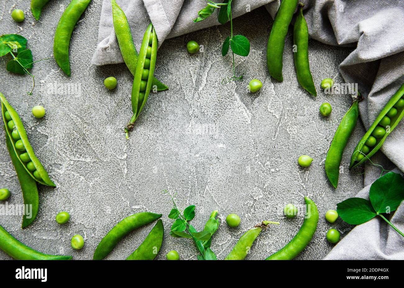 Pods of green peas on a concrete background. Organic food Stock Photo ...
