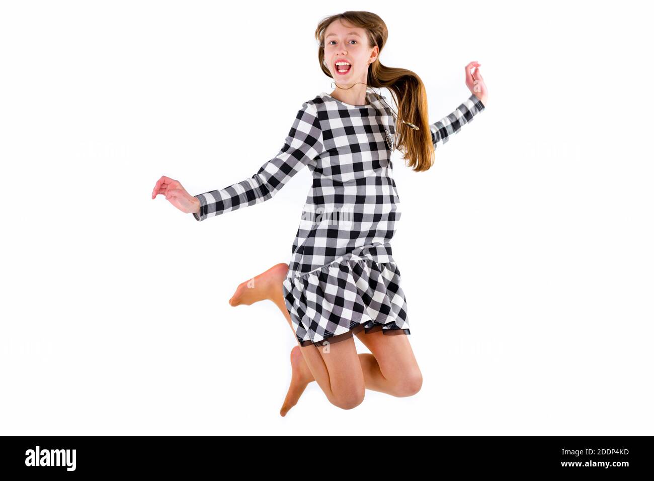 happy teen girl jumping up on white studio background Stock Photo - Alamy