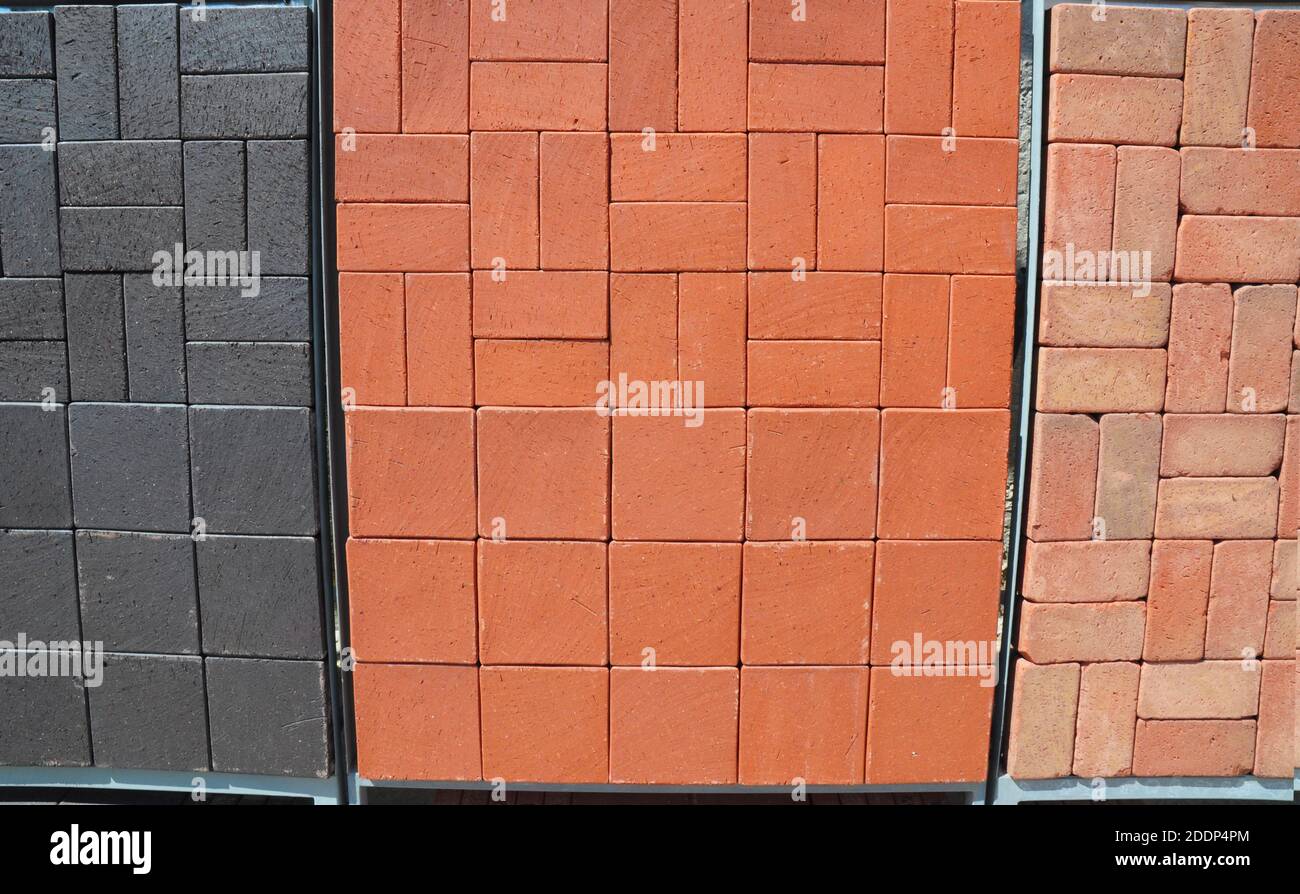 The display of black, red and orange patio pavers, paving stone with a ...