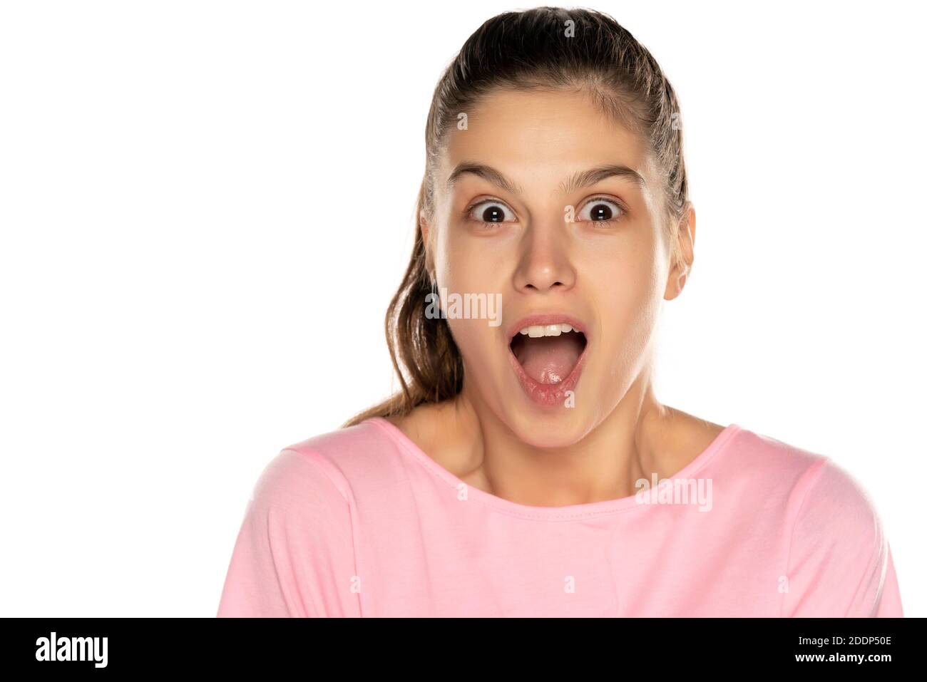 Portrait of young happy shocked woman without makeup on white ...