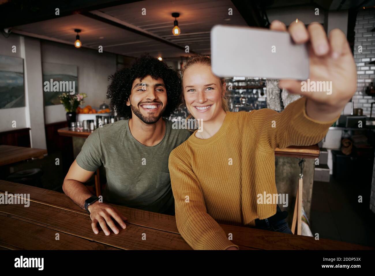 Woman using cellphone camera hi-res stock photography and images - Alamy