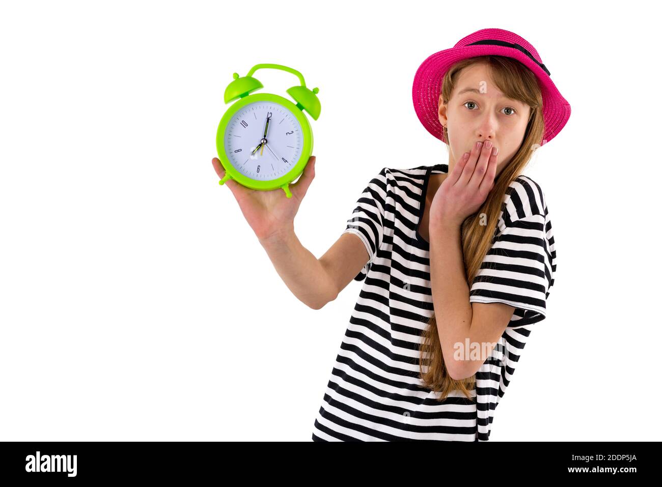 surprised Girl holding alarm Clock, isolated on white background ...