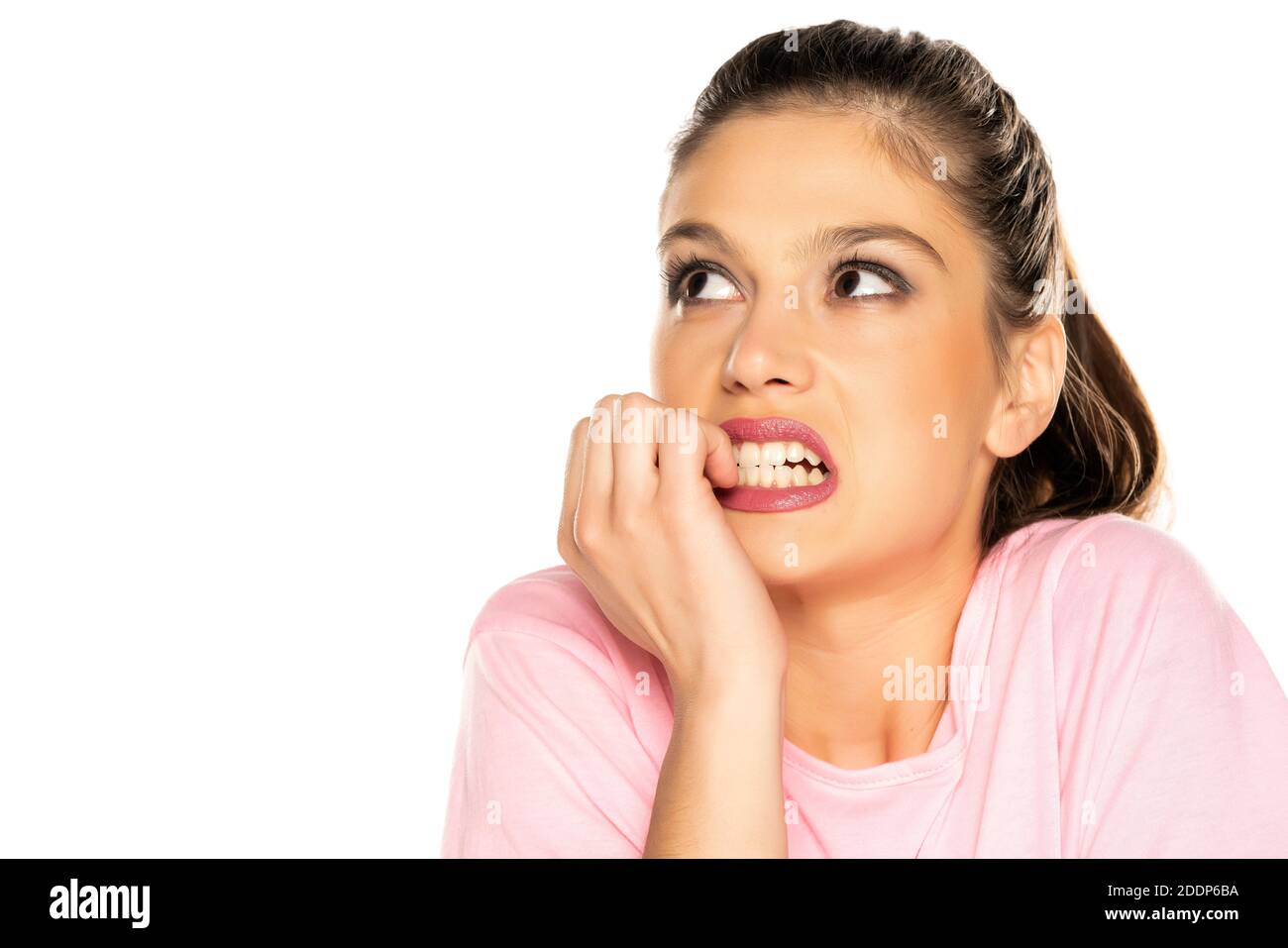 portrait of young concerned and nervous woman on white background Stock ...