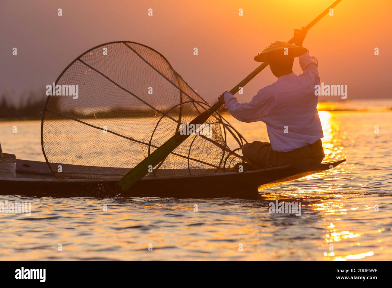 Inle Lake Myanmar Intha leg rowing fishermen at sunset at Inle Lake ...