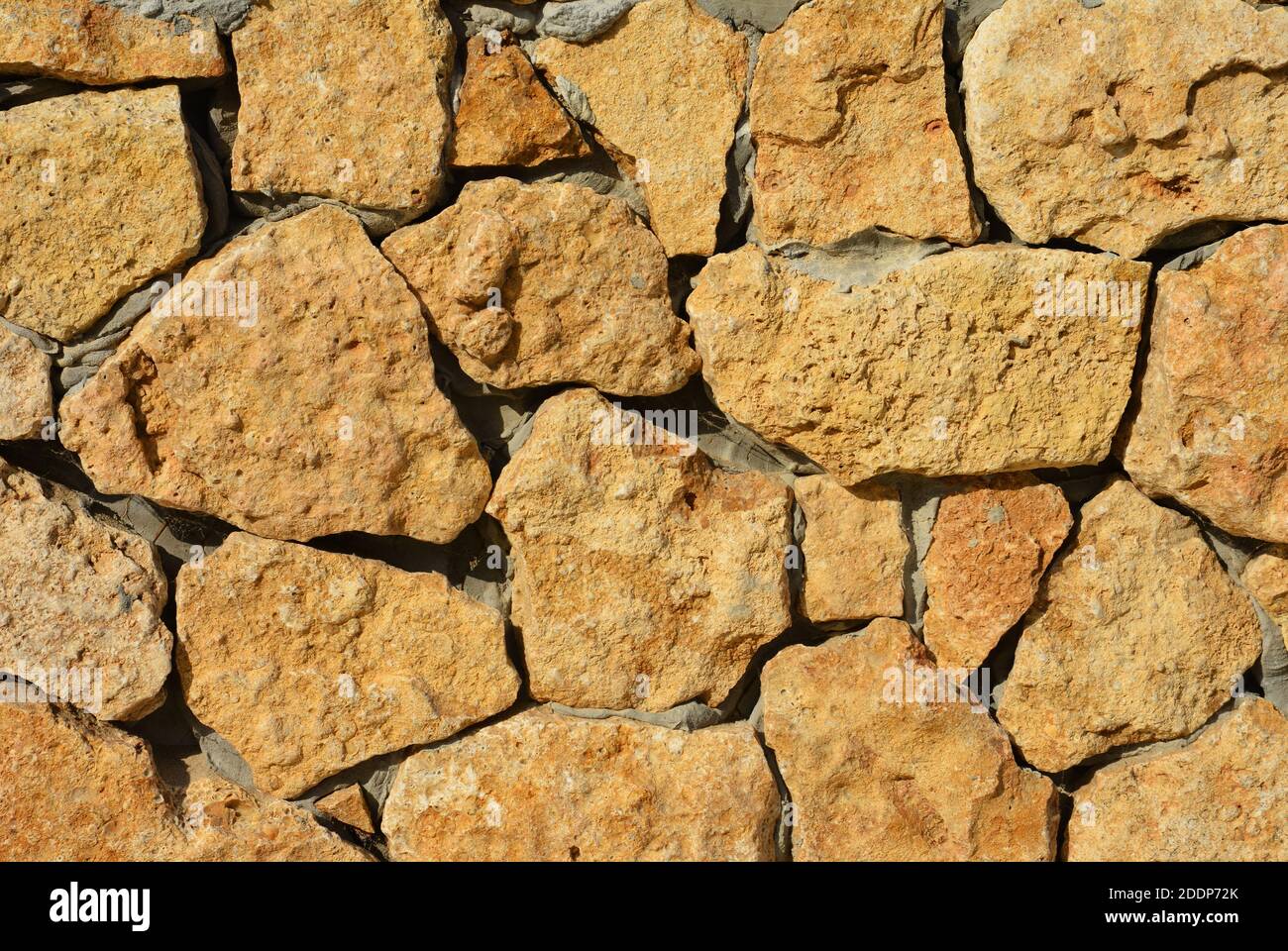 Natural wild stone castle wall cladding. Rough rock limestone wall ...