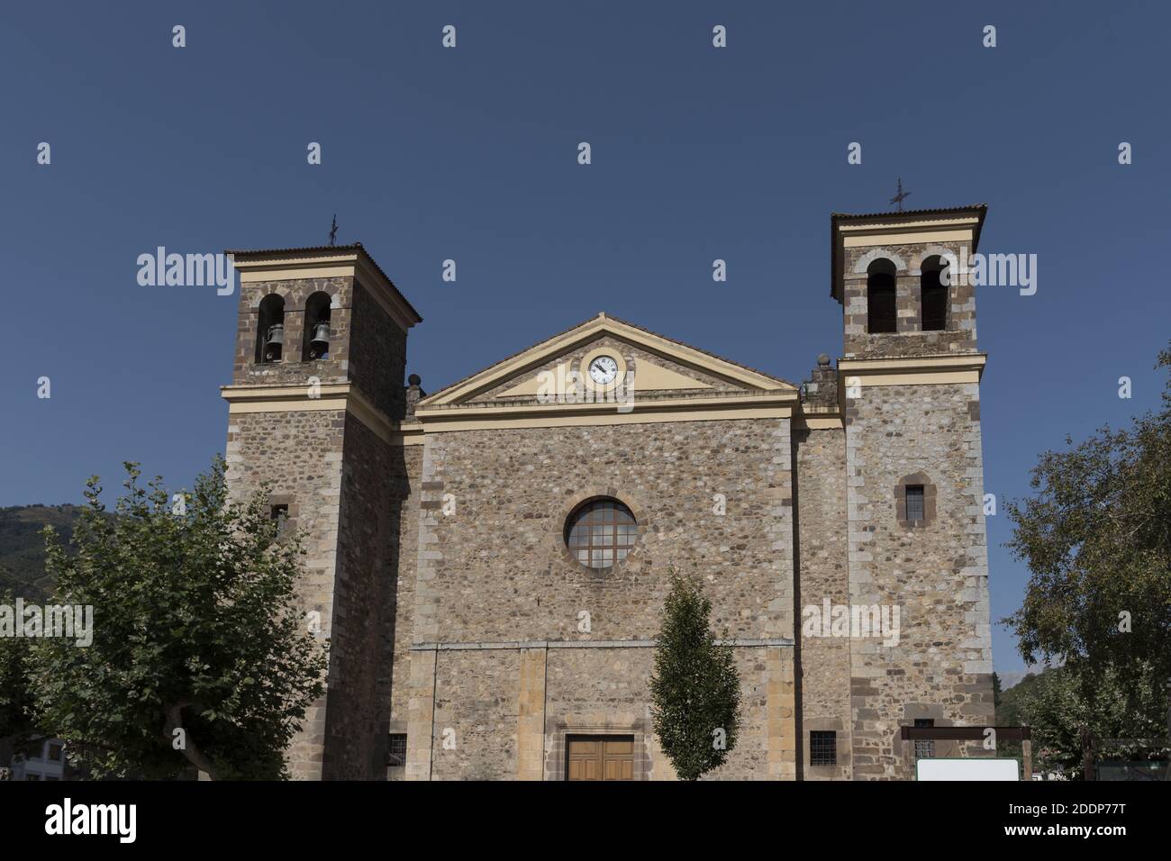 A historical ancient bell tower under a clear sky in Potes, Cantabria ...
