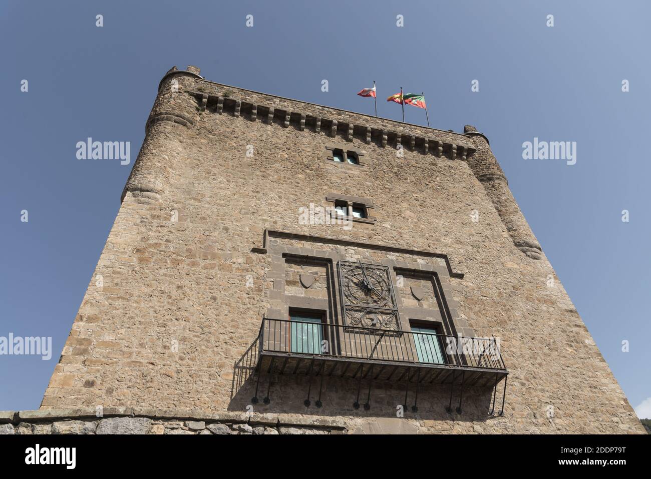 A low angle shot of a stone-made historical medieval tower in Potes ...