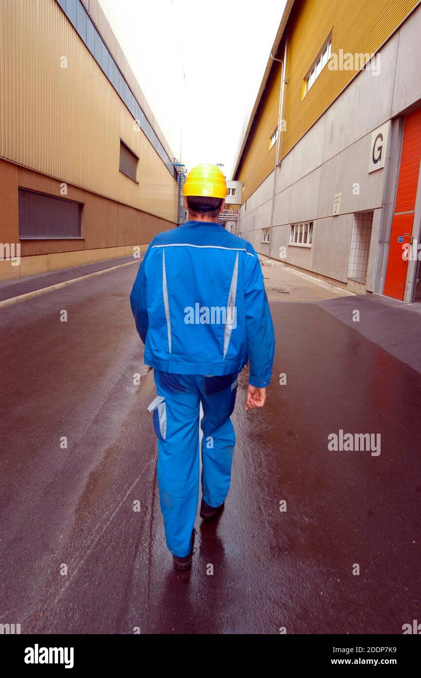 an industrial worker with safety helmet at his work place Stock Photo ...
