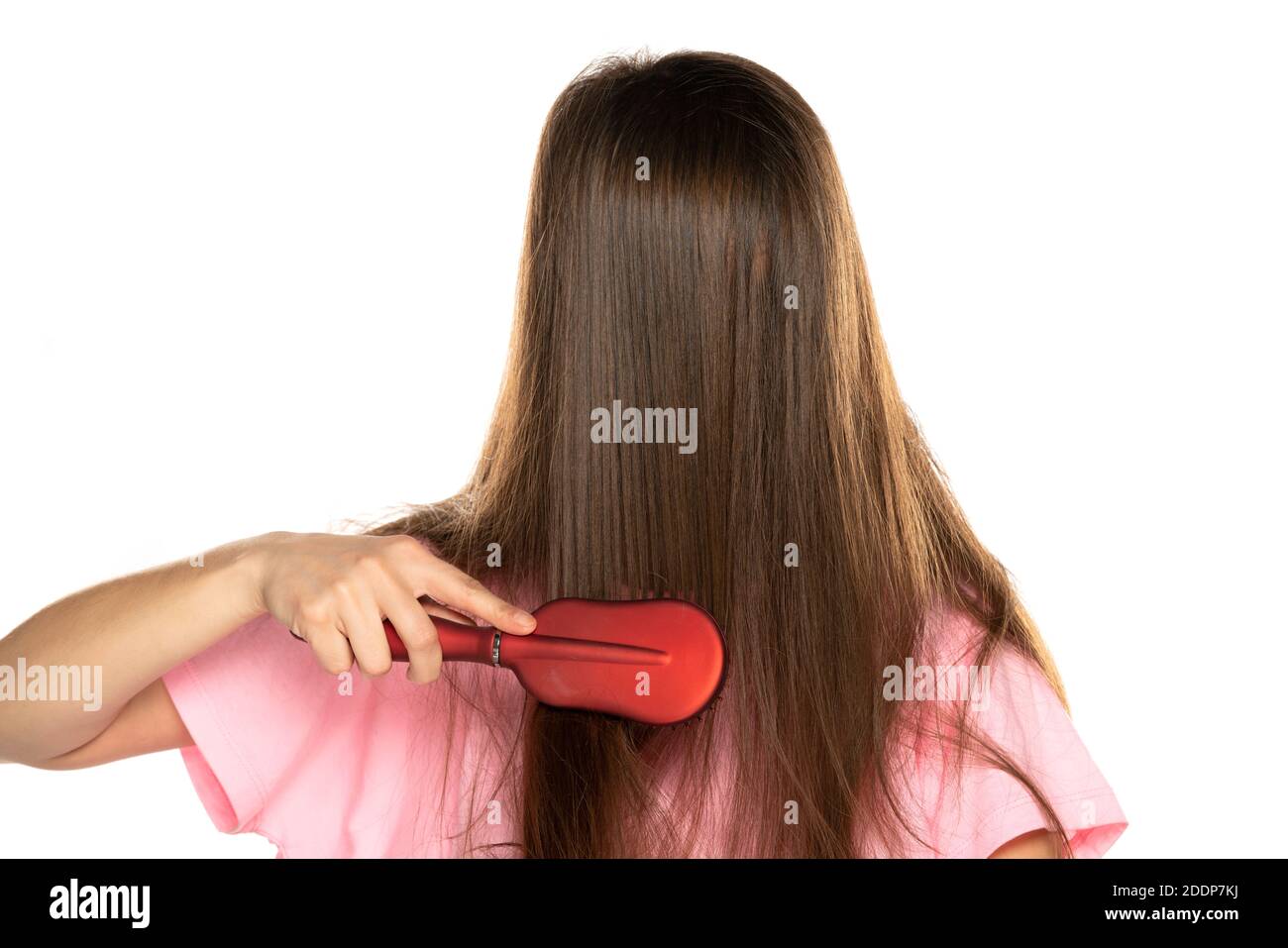 A woman combing the hair over her face on white background Stock Photo ...
