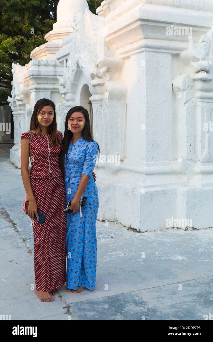 Two pretty young women with thanaka on cheeks posing for photos at ...