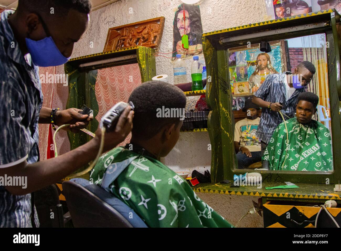 Barber with his first client right after business reopened. Barbers ...