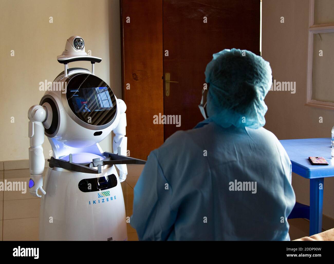 Robot technician at Kanyinya Health center. Robots are used to minimize ...