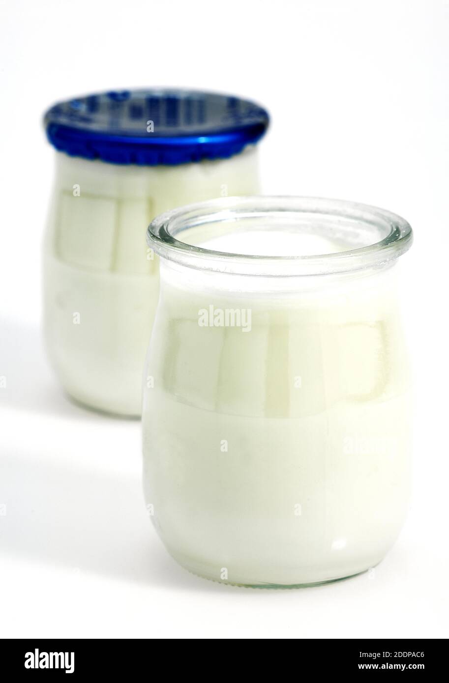 Glasses of Natural Yoghurt against White Background Stock Photo - Alamy
