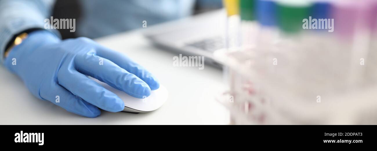 Assistant hand in rubber glove hi-res stock photography and images - Alamy
