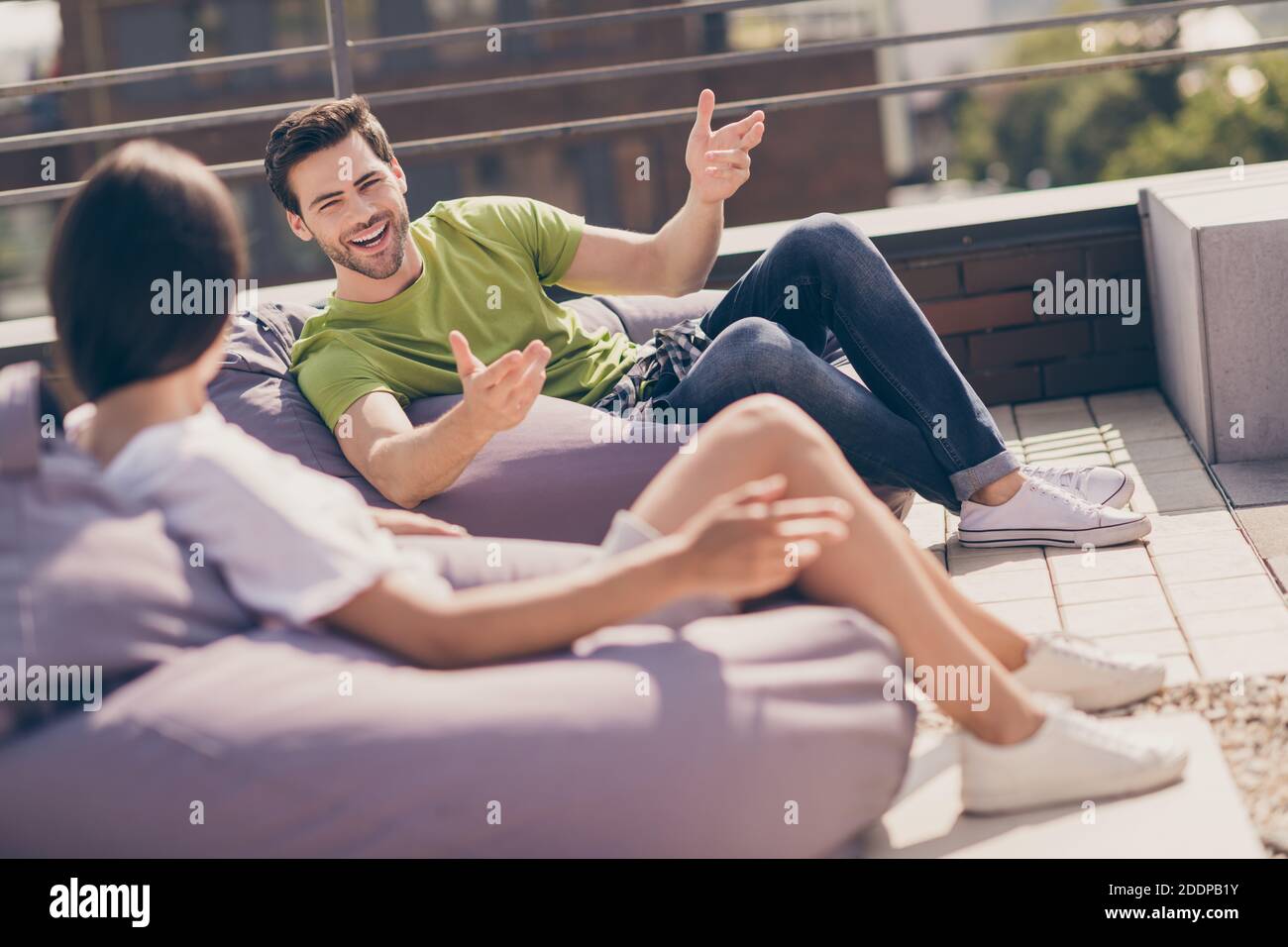 Full size portrait of two nice friendly persons have good mood sit on ...