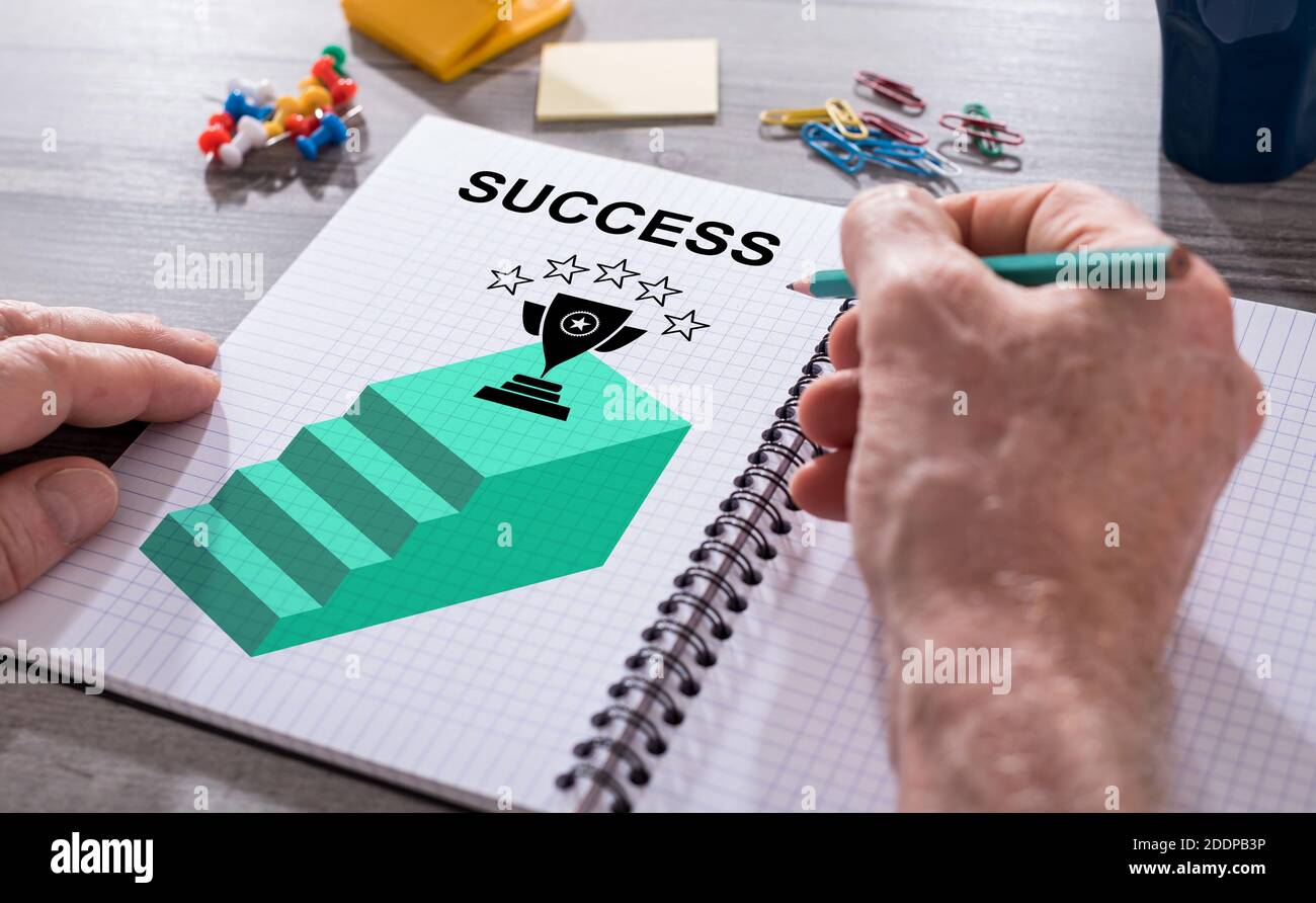 Hand drawing success concept on a notepad Stock Photo - Alamy