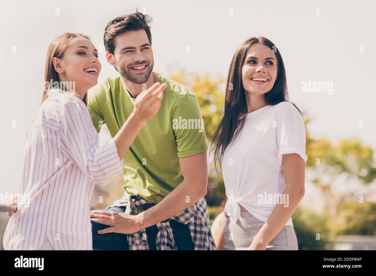 Portrait of company of three good friends travellng together have ...