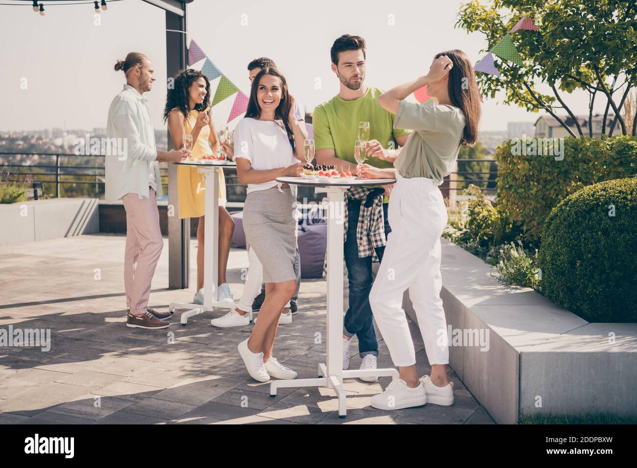 Full length photo of cheerful crowd of friends arms hold drink stand by ...