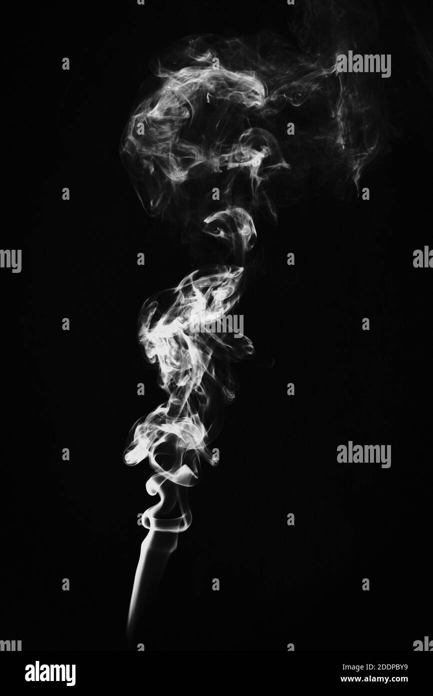 Trail of the smoke on a black paper Stock Photo - Alamy