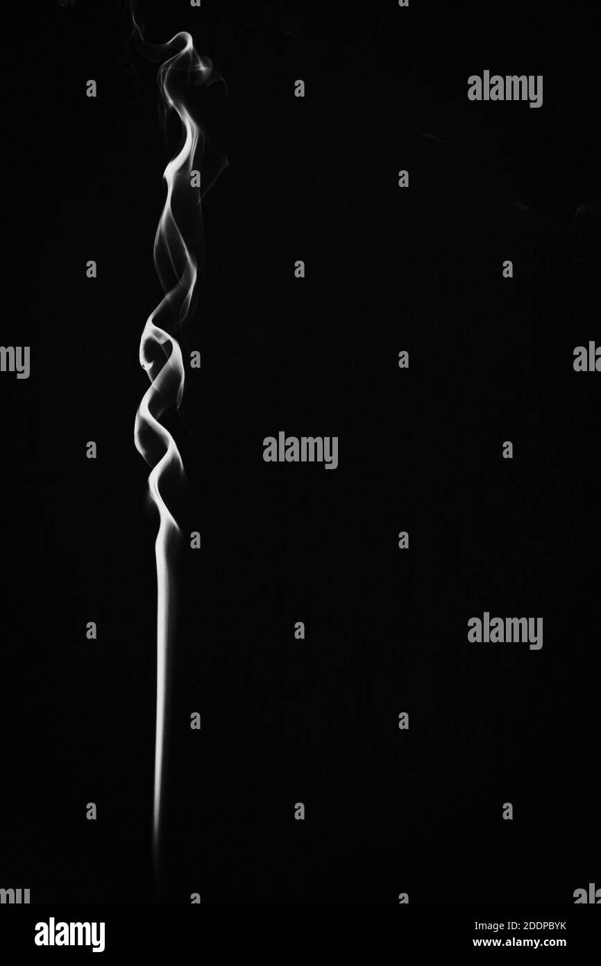 Trail of the smoke on a black paper Stock Photo - Alamy