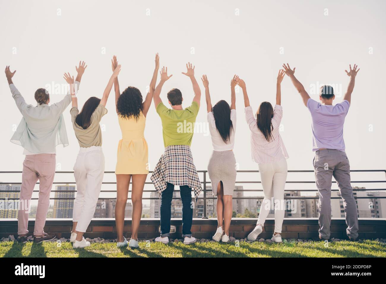 Photo of funny pretty girls handsome guys standing hands up have fun ...
