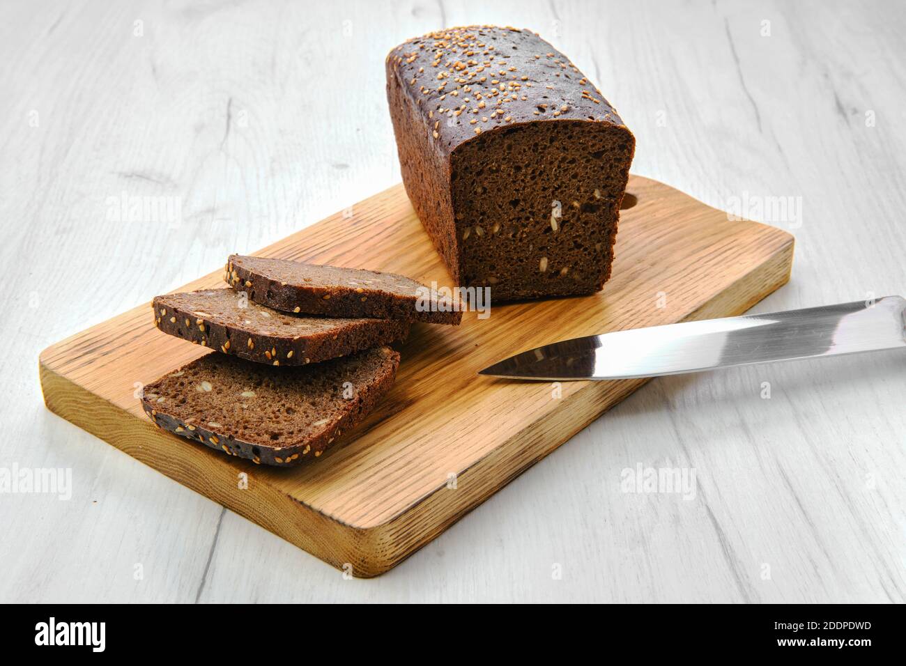 Top view of loaf of brown sourdough bread with sunflower seeds and ...