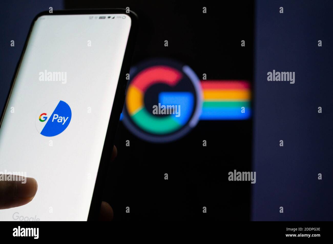 Google Pay app logged in on a mobile infront of a black screen with ...