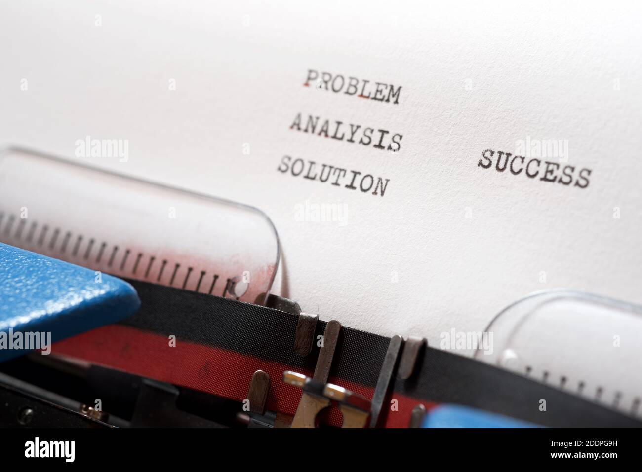 Problem analysis solution and success words written with a typewriter ...