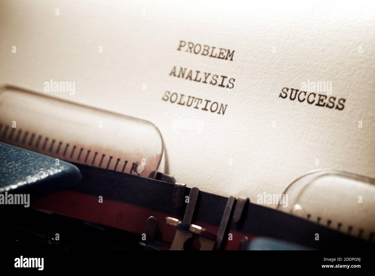 Problem analysis solution and success words written with a typewriter ...