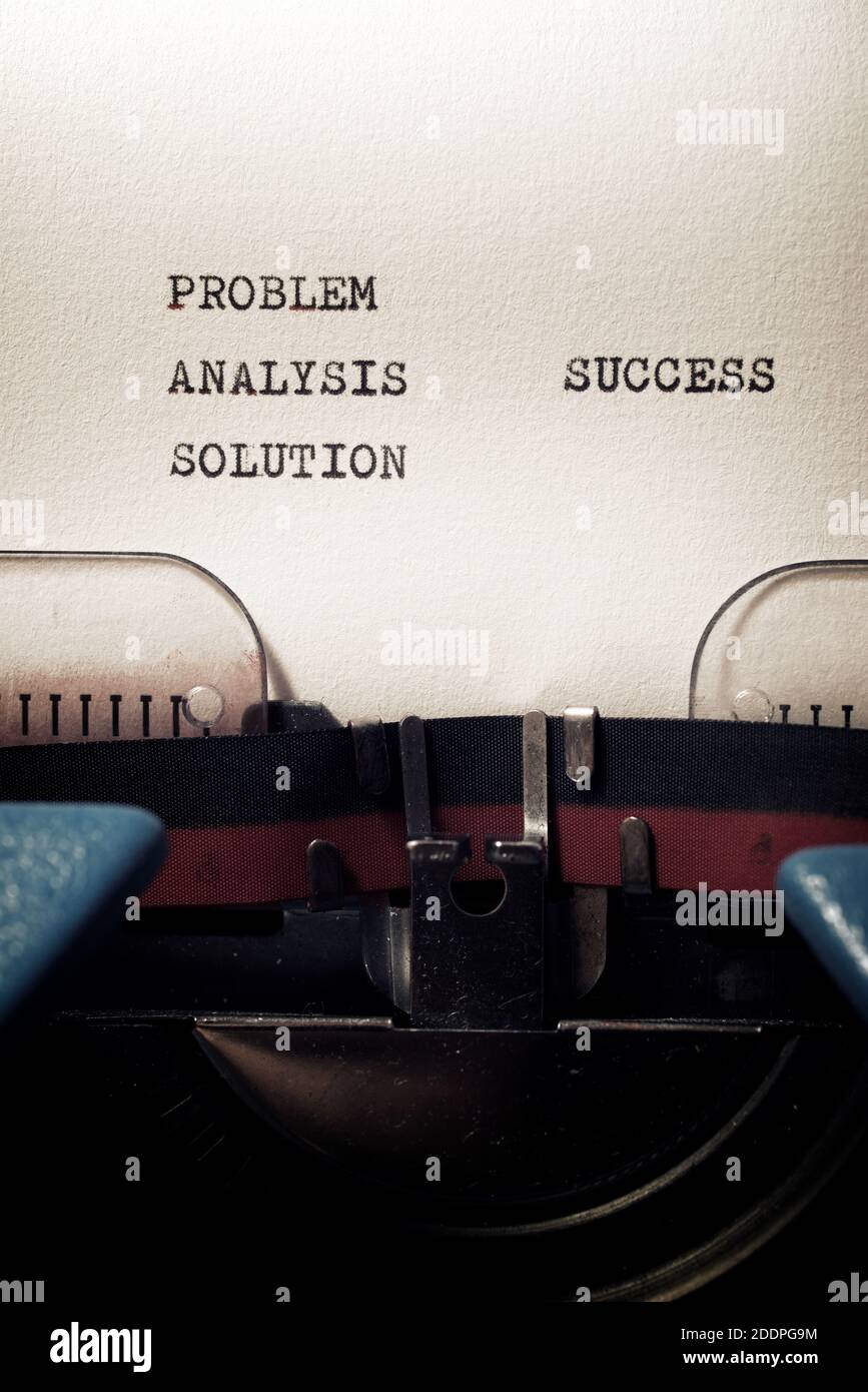 Problem analysis solution and success words written with a typewriter ...