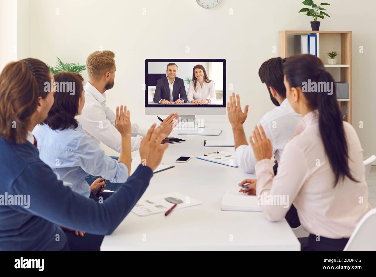 Group of company workers having video call meeting with executive and ...