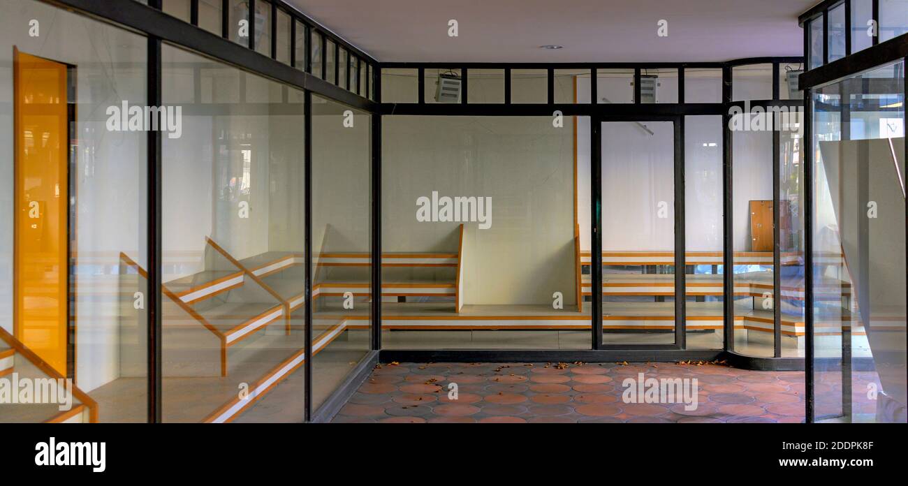 room with empty shop windows and racks Stock Photo - Alamy