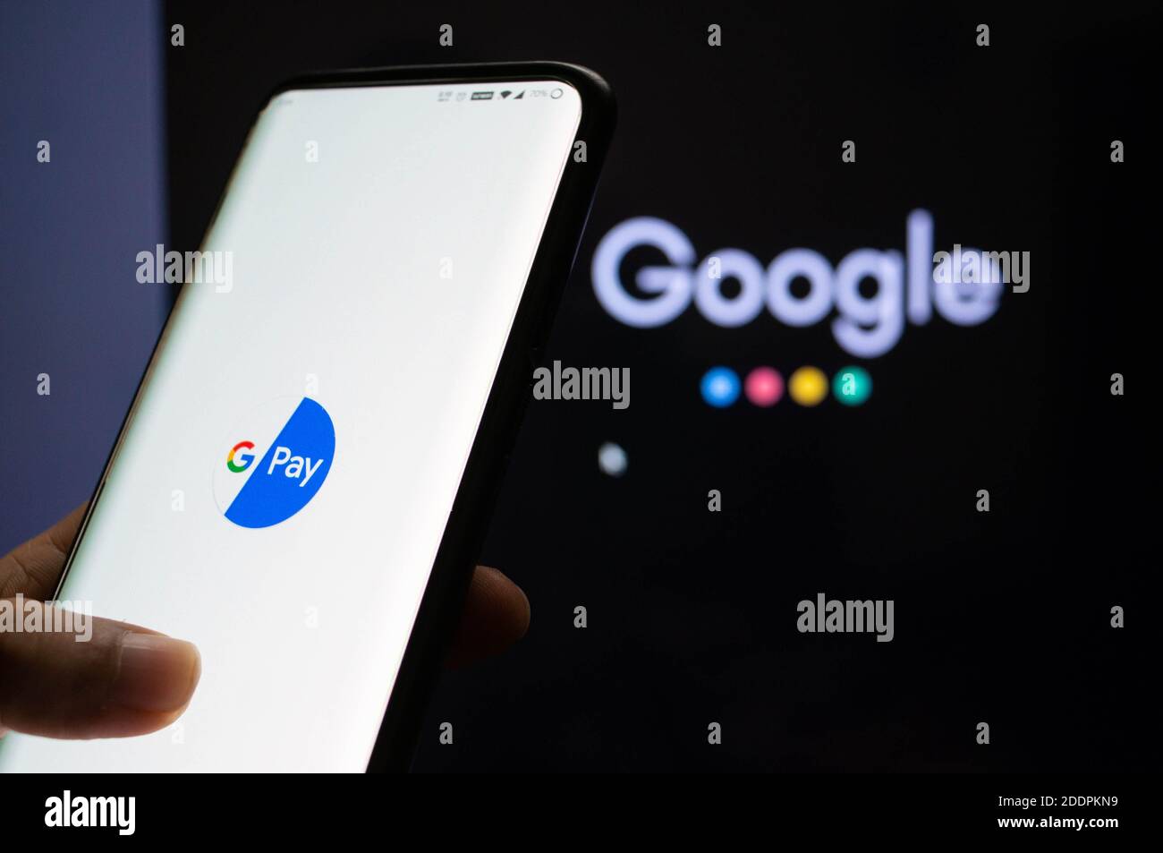 Google Pay app logged in on a mobile infront of a black screen with ...