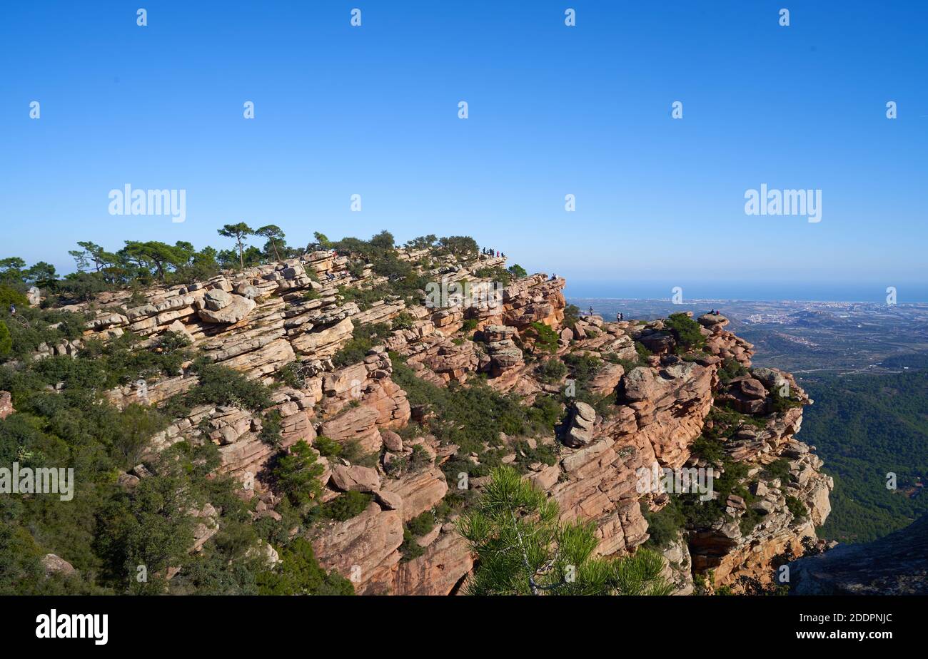 A beautiful natural landscape with rocky cliffs surrounded by greenery ...