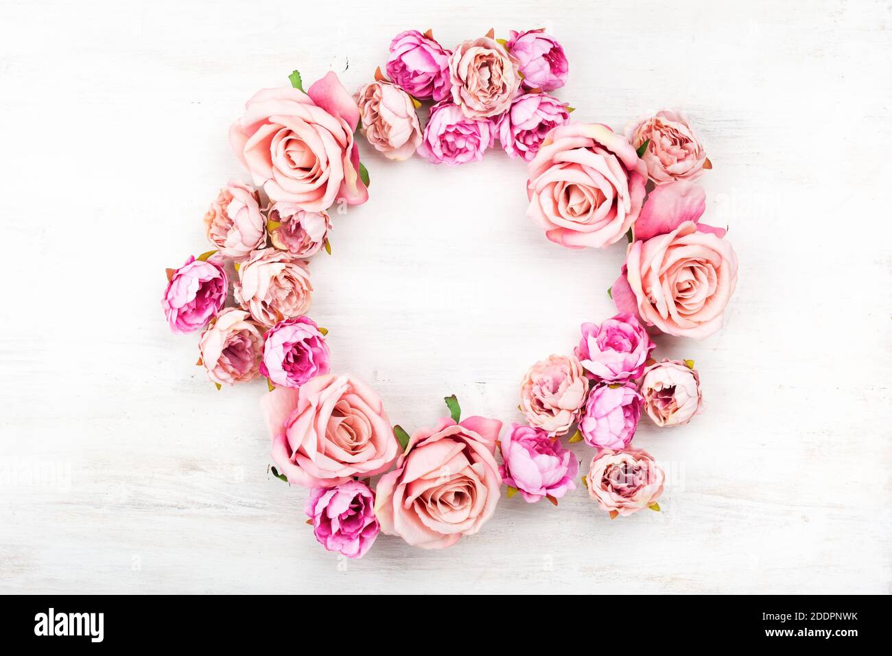 Floral frame on white wood table top view Stock Photo - Alamy