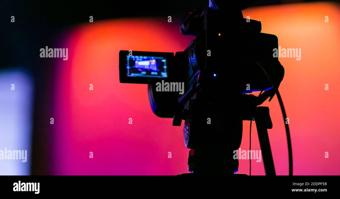 A video camera recording an illuminated stage Stock Photo - Alamy